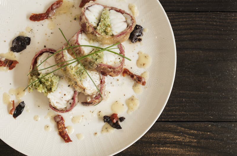 Cod fish wrapped in bacon stock photo. Image of mustard - 122830162