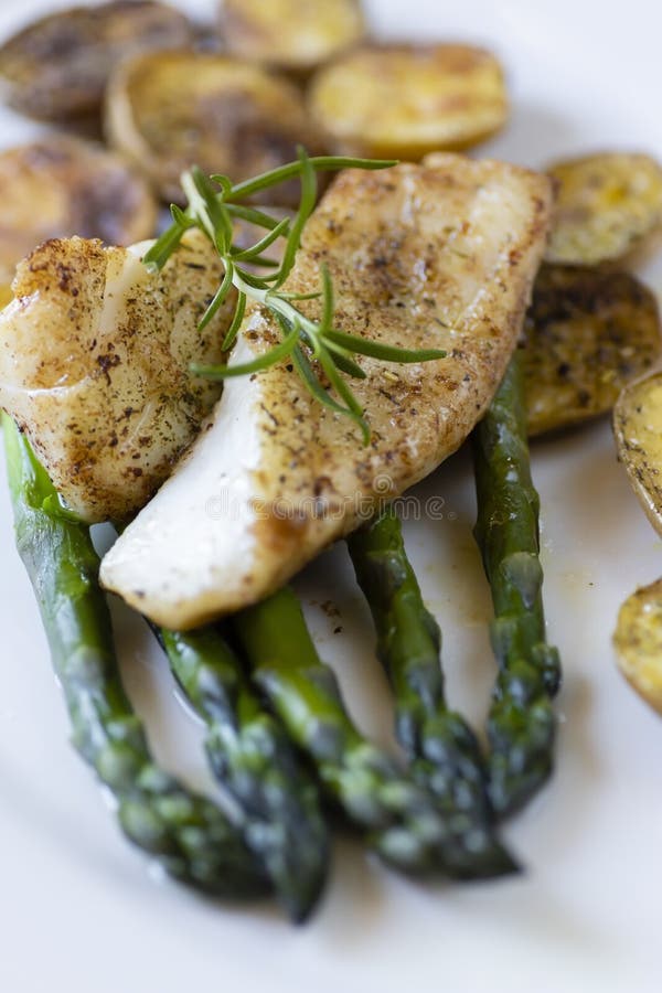 Cod with Green Aparagus and Roasted Potatoes Stock Image - Image of ...