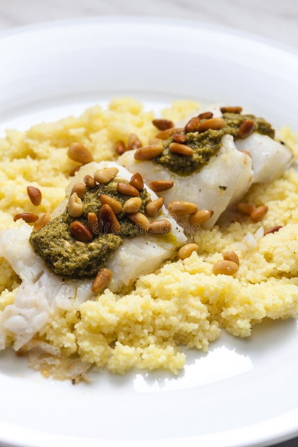 Cod with Green Pesto and Pine Seeds with Couscous Stock Image - Image ...