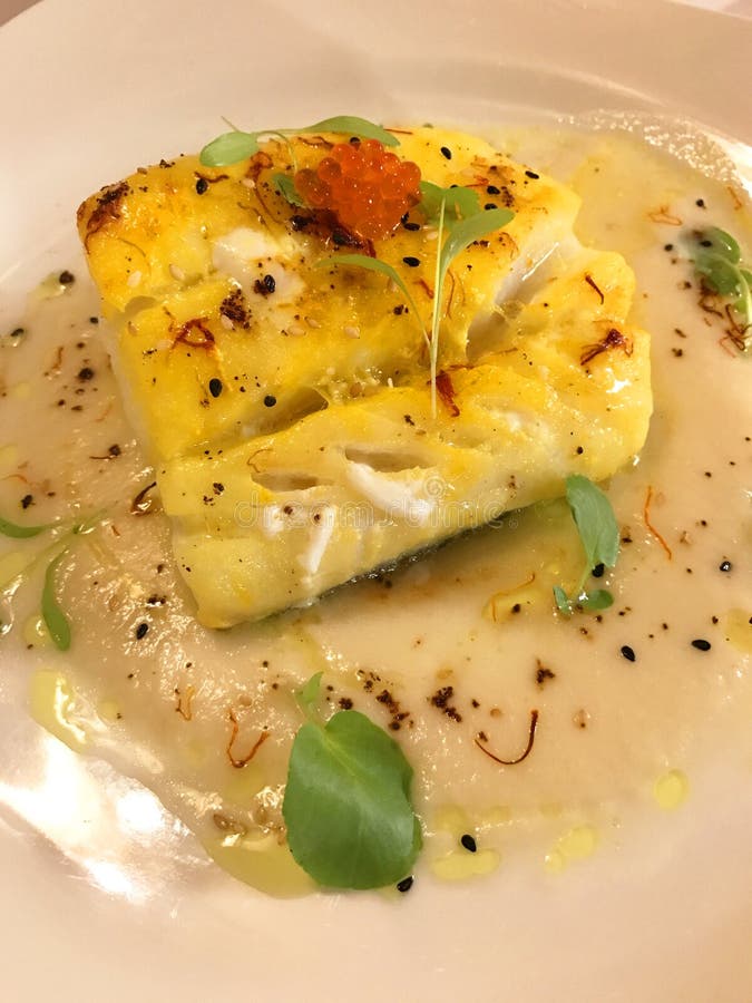 Cod Loin with Garlic Sauce. Spain Stock Photo - Image of vertical ...