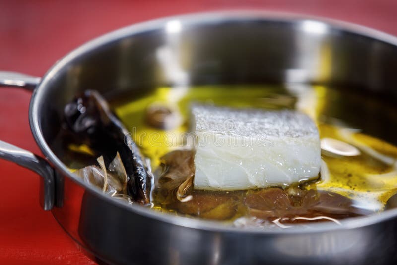 Cod soaking in olive oil stock photo. Image of white - 343274186