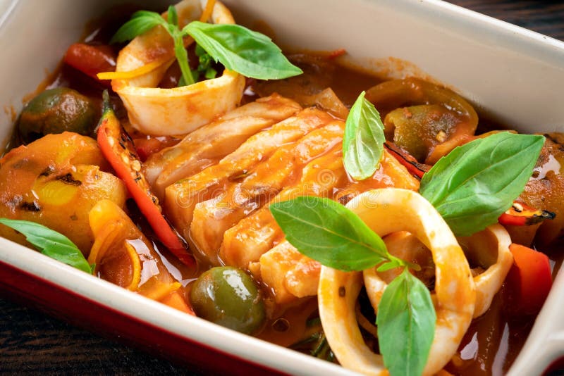 Cod Stewed with Vegetables and Basil in Tomato Sauce in a Deep Dish ...