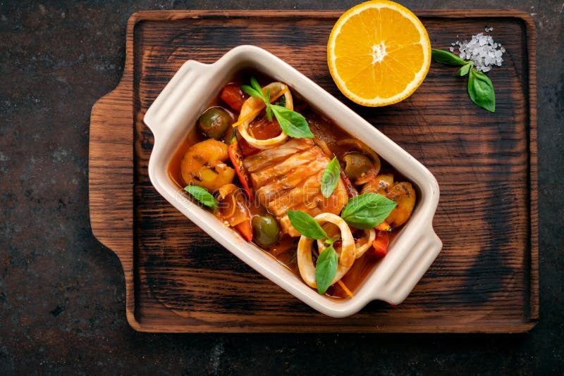 Cod Stewed with Vegetables and Basil in Tomato Sauce in a Deep Dish ...