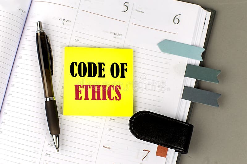 CODE of ETHICS Word on the Yellow Sticky with Office Tools on daily ...