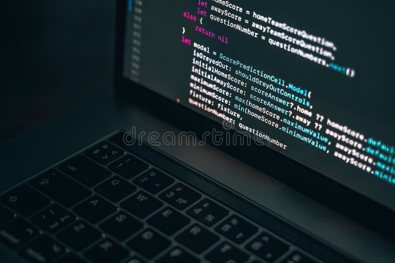 The Code on the Laptop Screen at Night. Software Development Stock ...