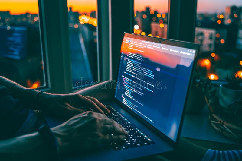 The Code on the Laptop Screen at Night. Software Development Stock ...