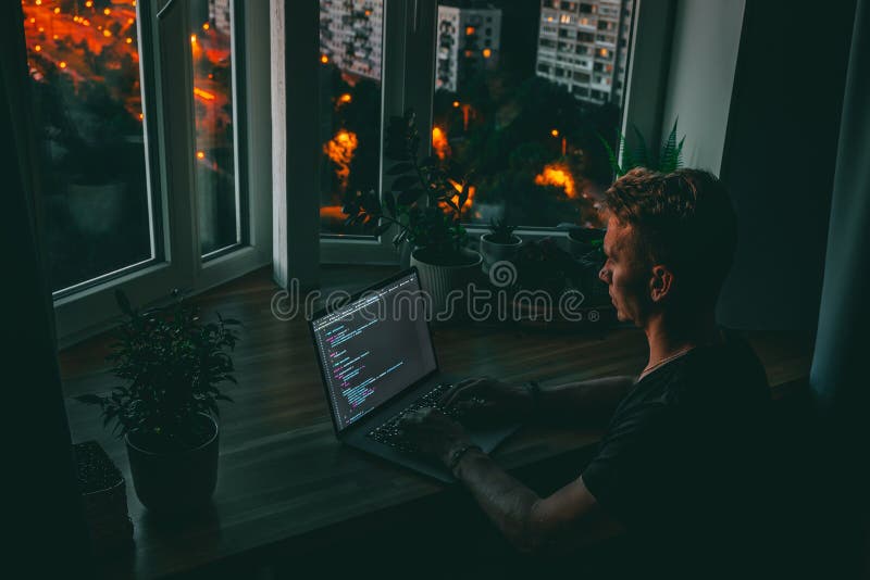 The Code on the Laptop Screen at Night. Software Development Stock ...