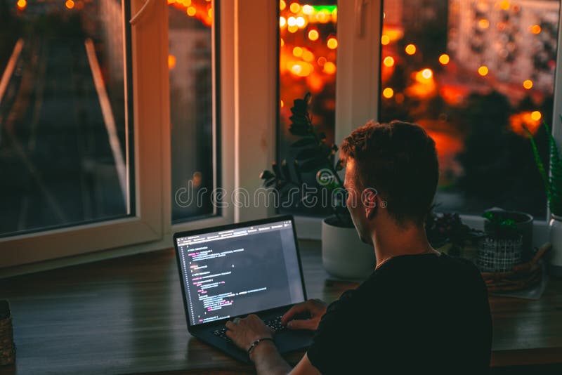 The Code on the Laptop Screen at Night. Software Development Stock ...