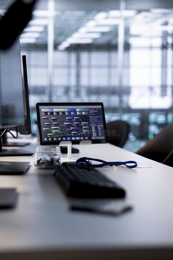 Code Running on Computer Screens and Tablet in Empty Data Center Stock ...