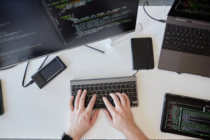 Coding on Keyboard Surrounded by Multiple Monitors Stock Photo - Image ...