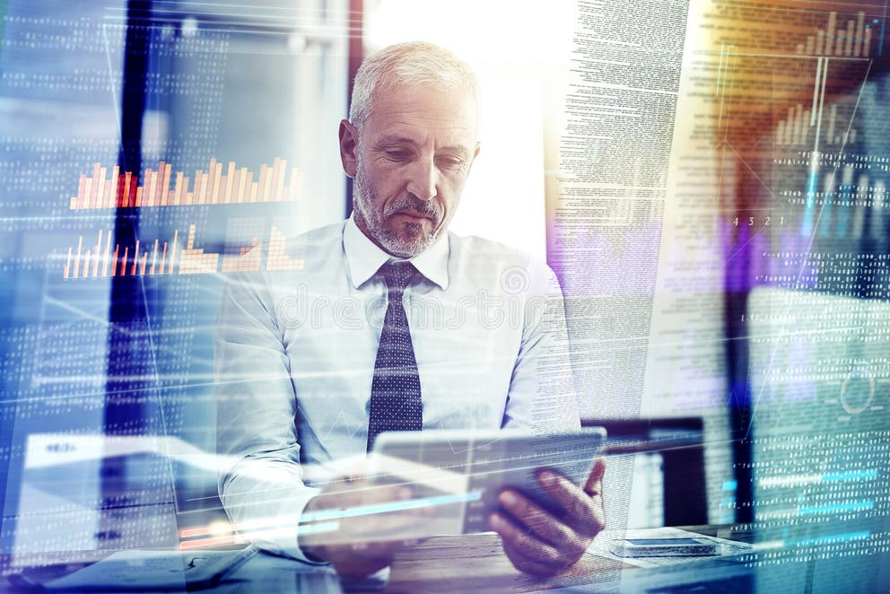 Coding on Multiple Platforms at Once. a Mature Businessman Working on ...