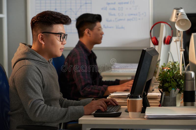 Coding young people stock photo. Image of startup, occupation - 147445122