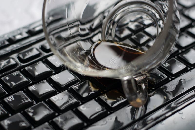 Liquid Spilled on a Black Keyboard Close-up Stock Photo - Image of ...