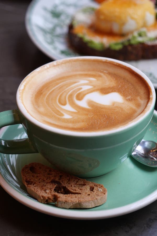 Coffee with Artful Foam in a Cozy Cafe Setting Stock Photo - Image of ...