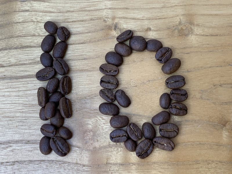 The Coffee Beans Arranged Form a Figure Ten on a Wooden Table. Stock ...