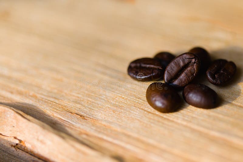 Coffee Beans Arranged on a Piece of Raw, Freshly Split Wood Stock Image ...