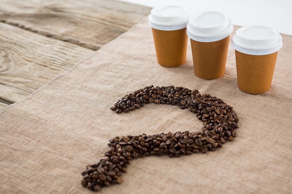 Coffee Beans Arranged in Question Mark Shape with Disposable Coffee ...
