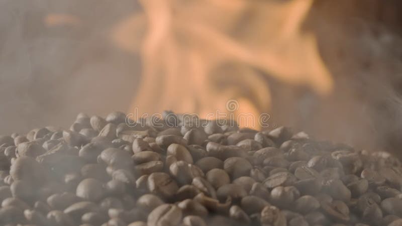 Coffee Beans Being Roasted on a Black Studio Background. Coffee ...
