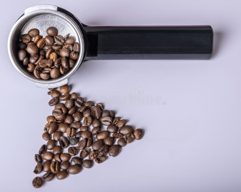Coffee Beans are in a Boom Arm for Coffee Machine and on a White Table ...