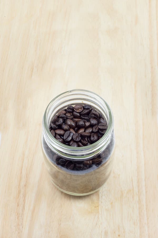 Coffee Beans in Bottle on Wood Block Stock Image - Image of bottle ...