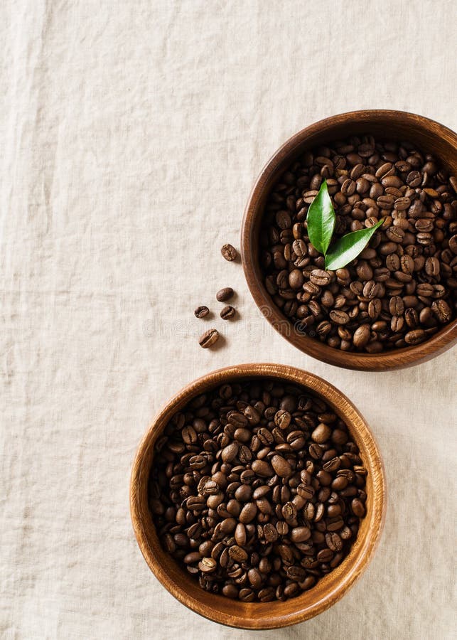 Coffee Beans in Bowl with Leaf on Table Cloth Grey Texture Stock Photo ...
