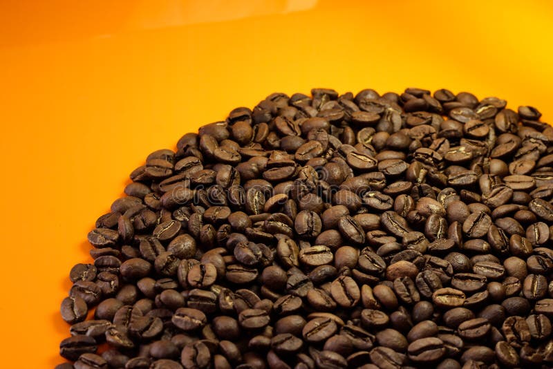 Coffee Beans on a Bright Background. Coffee Granules on an Orange Table ...