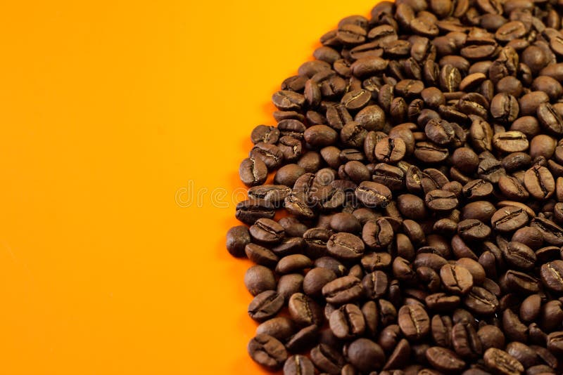 Coffee Beans on a Bright Background. on the Orange Table Grain of the ...