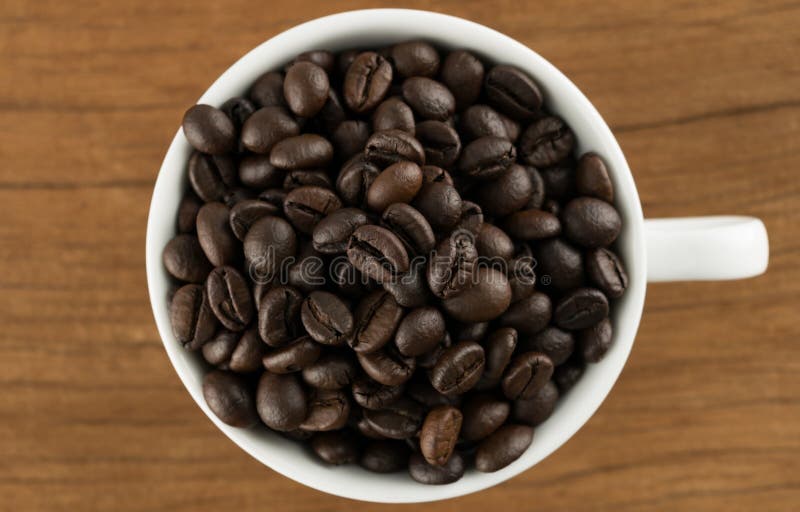 Coffee Beans in Coffee Cup on Table Wood Background Stock Image - Image ...