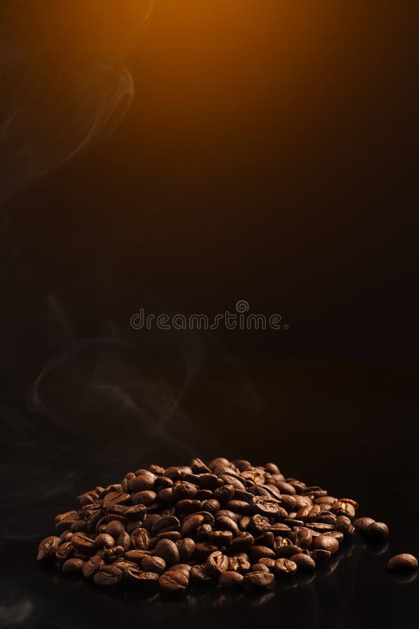 Coffee Beans on a Dark Background with a Yellow Highlight on the ...