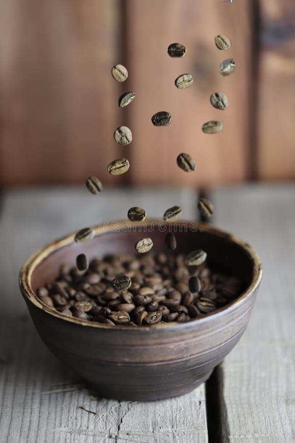 Coffee Beans Fall into the Plate Stock Photo - Image of cocoa, energy ...