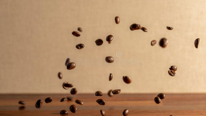 Coffee Beans Floating in the Air Over the Wooden Table Stock Image ...