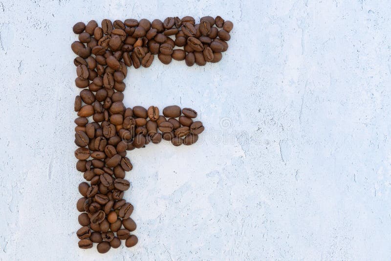 Coffee Beans on Light Blue Background Shaped As an F Stock Photo ...
