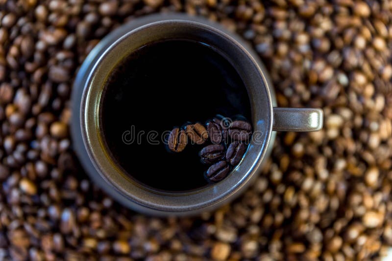 Coffee Beans and Coffee in a Mug Stock Image - Image of bean, delicious ...