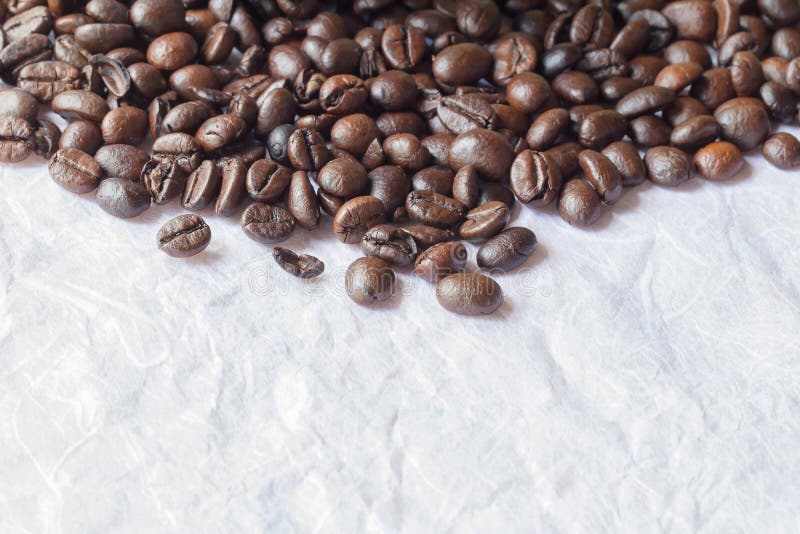 Coffee beans on paper stock photo. Image of aromatic - 65477642