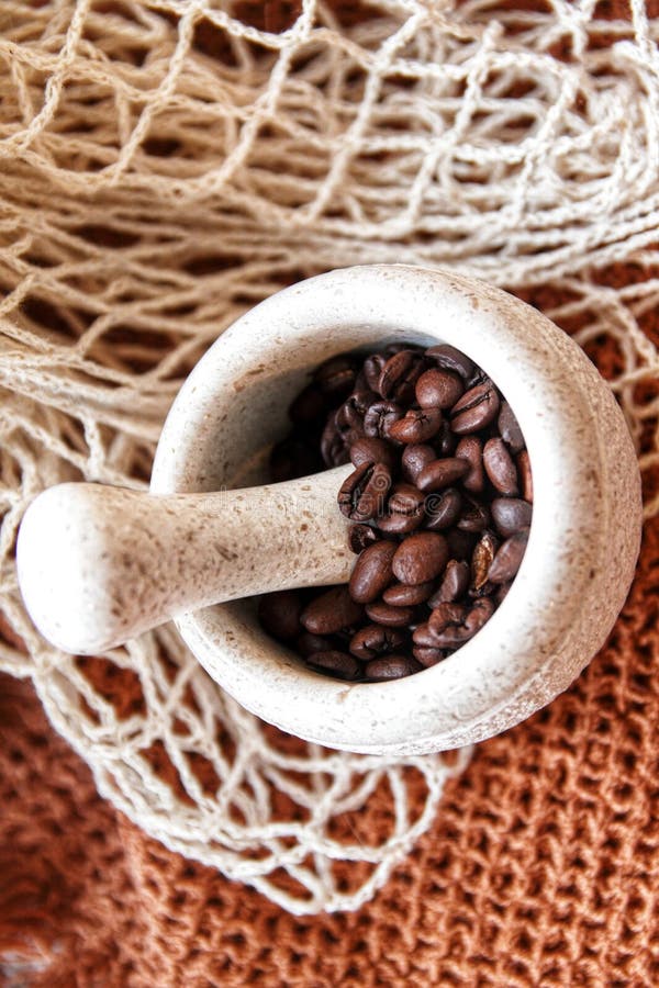 Coffee beans in a pestle stock image. Image of brown - 315807101