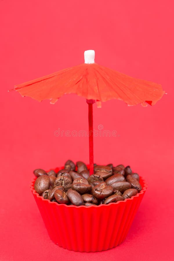 Coffee Beans in a Red Container on a Red Background and a Decorative ...