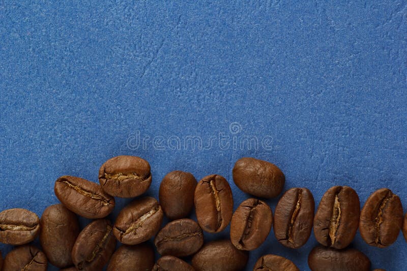 Coffee Beans are Scattered on a Blue Background from the Edge of the ...
