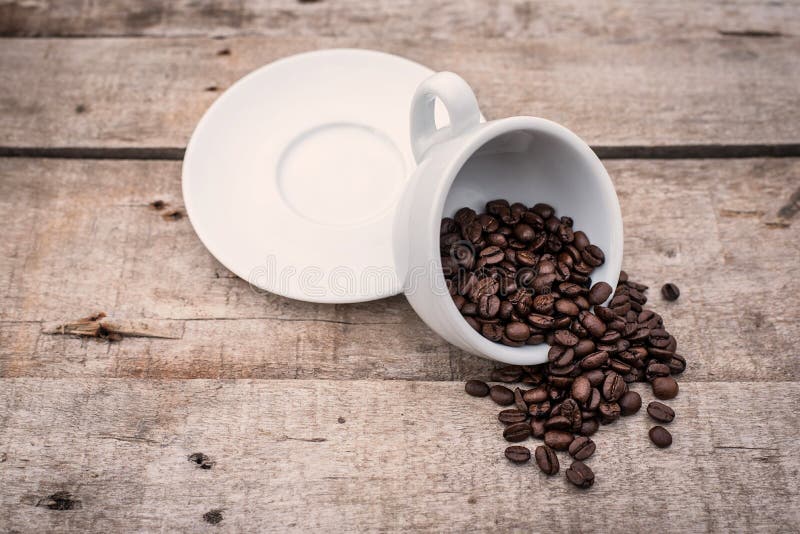 Coffee Beans Spilling Out of a Cup Stock Photo - Image of fresh, food ...