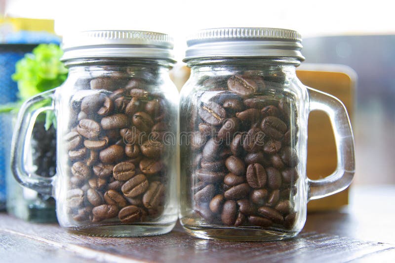 Coffee Beans in Two Bottles Placed on the Table. Stock Image - Image of ...