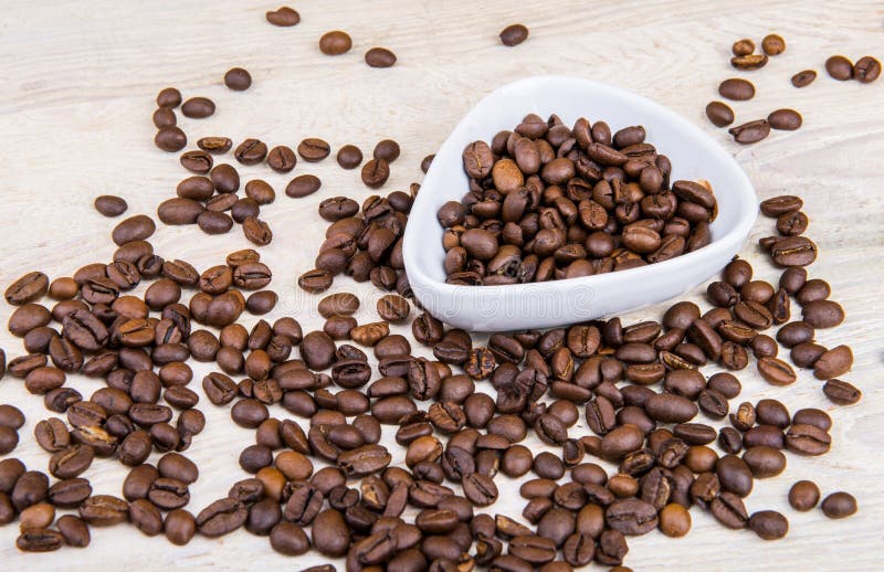Coffee Beans in White Shell on Wooden Background Stock Image - Image of ...