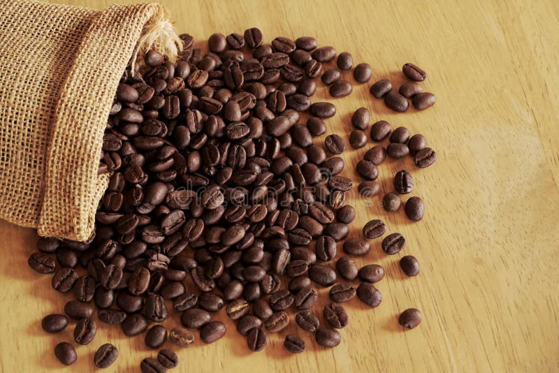 Coffee Beans on Wood Table. Organic Coffee Seed Stock Photo - Image of ...