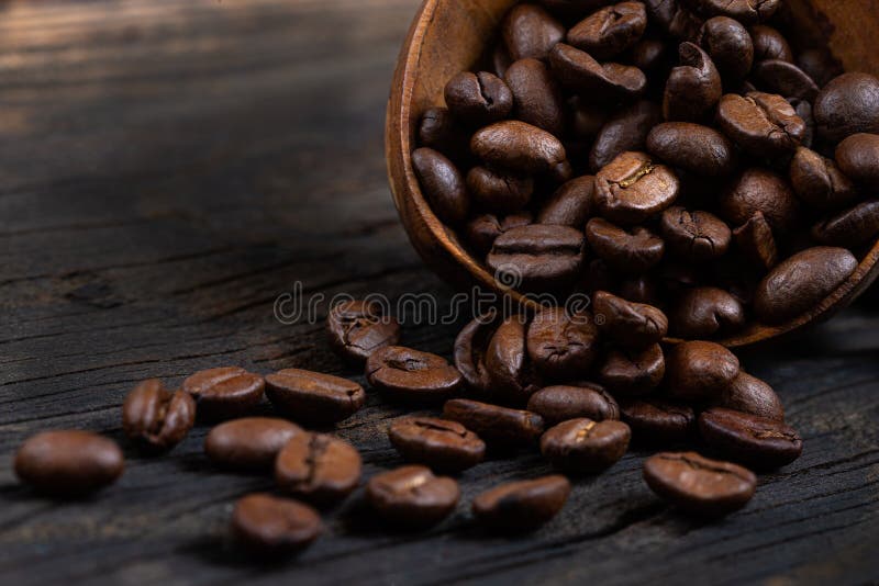 Coffee Beans with Wooden Ladle ,on Old a Wooden Background Stock Photo ...