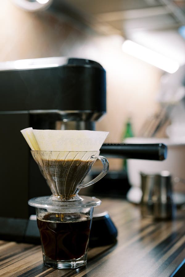 Coffee Being Filtered in a Pour Over Coffee Machine on the Table Stock ...