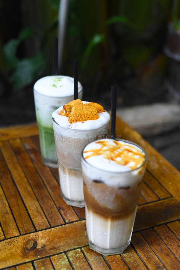 Coffee Beverages on Wooden Table in a Coffee Shop Stock Image - Image ...