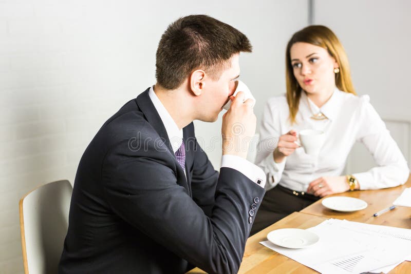 Coffee Break Chat. Group of Attractive Business People Holding a Cups ...