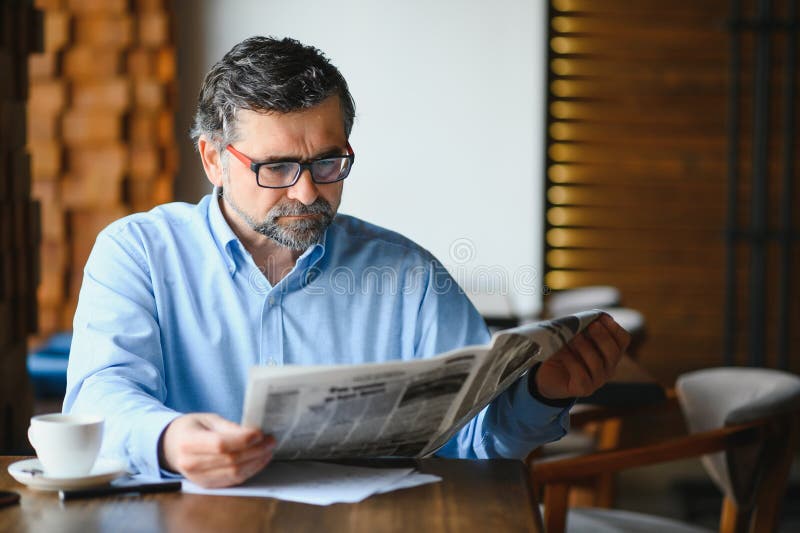 Coffee Break. Man Drinking Coffee and Reading Newspaper in Cafe Bar ...