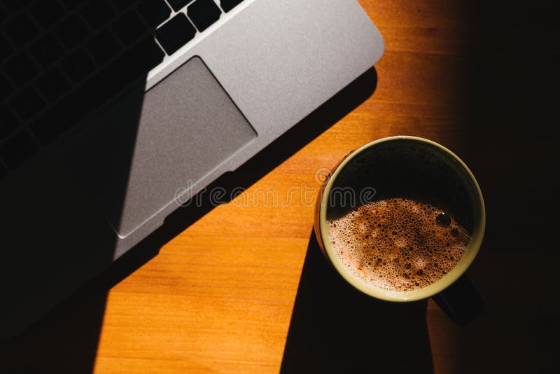 Coffee Break in the Office, Laptop Computer and Coffee Cup on the Desk ...