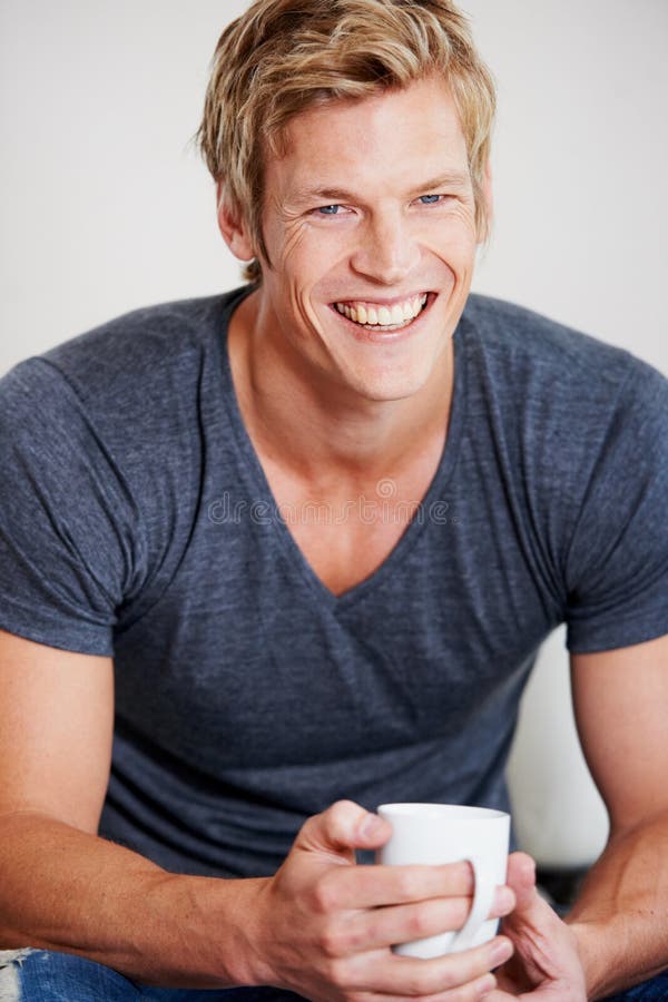 Coffee Break. Portrait of a Handsome Young Man Enjoying a Cup of Coffee ...