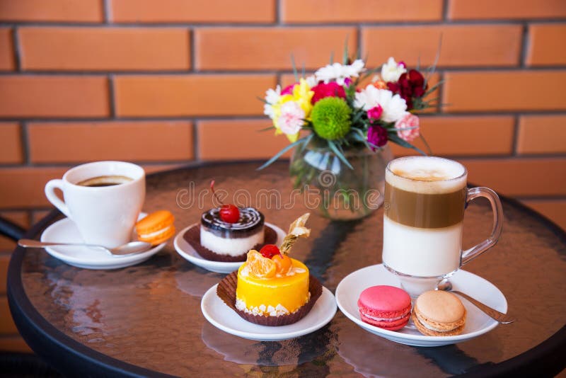 Coffee and cakes on table stock image. Image of chocolate - 115630343