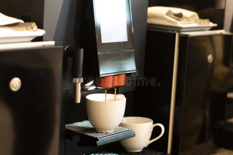 Coffee Coming Out of the Automatic Maker in the Hotel for Customer ...
